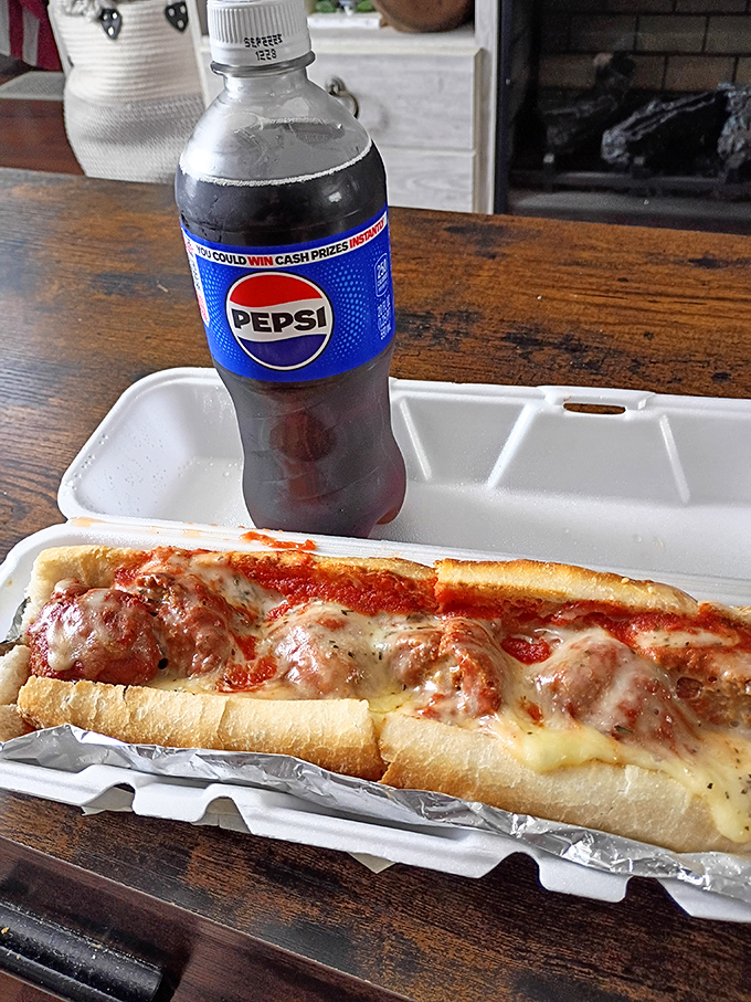 A proper Italian meatball sandwich paired with a cold Pepsi&mdash;comfort food that speaks a universal language of satisfaction.