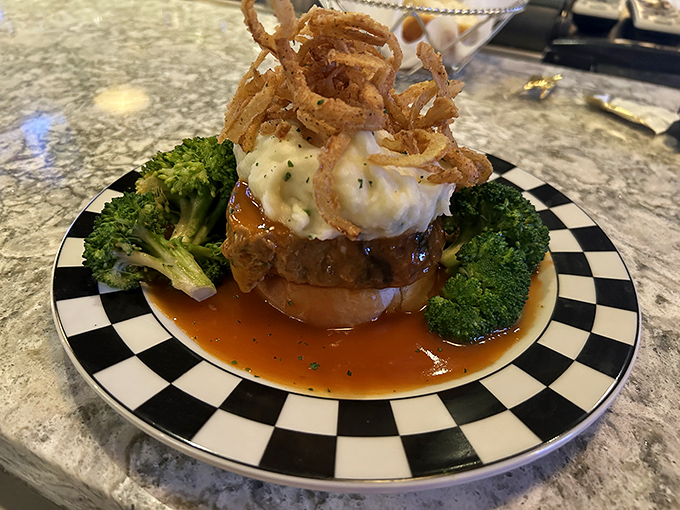 Meatloaf reimagined as a culinary masterpiece, crowned with crispy onions and surrounded by vibrant broccoli. Comfort food dressed for the red carpet.