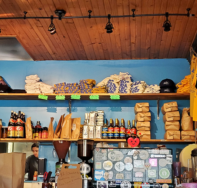 Behind the counter, colorful merchandise and coffee supplies create a backdrop that's as vibrant as the breakfast offerings themselves.