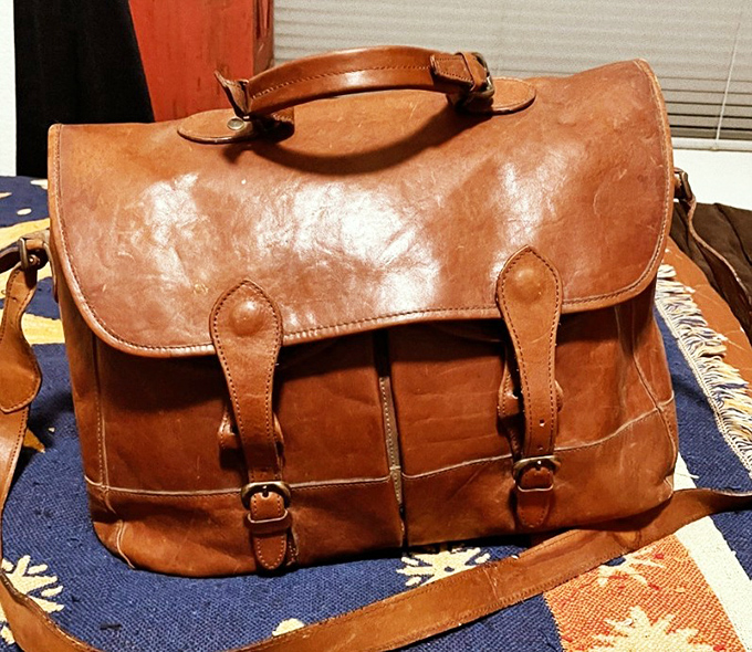 This leather messenger bag has stories to tell and plenty of room for yours. Vintage patina you can't fake at any price.