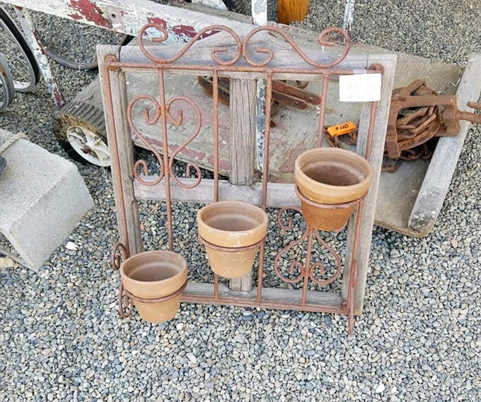 Rustic garden art that's weathered actual weather, ready to bring vintage charm to contemporary California patios. Those terracotta pots have seen things.