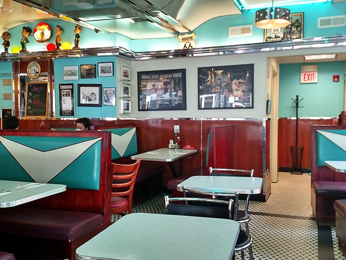 Booths designed for comfort and conversation. The Route 66 sign reminds us that diners are America's culinary highway.
