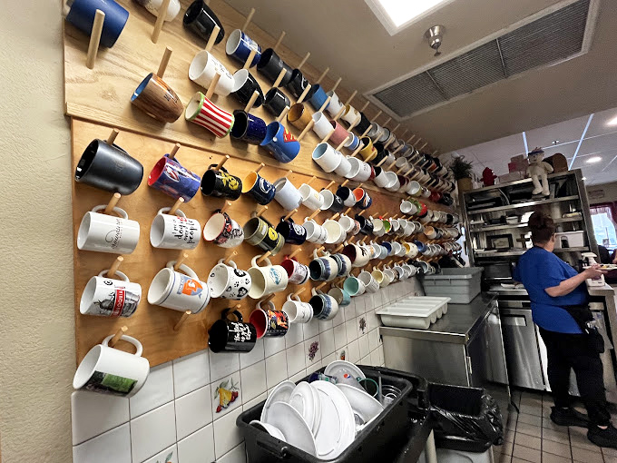 The wall of coffee mugs tells the story better than words could &ndash; this is a place where regulars leave a piece of themselves, one ceramic handle at a time.