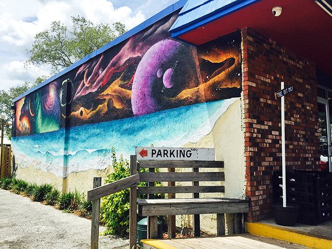 The cosmic beach mural on the exterior wall suggests your taste buds are about to take a similar journey. Sandwich shop or portal to another dimension?