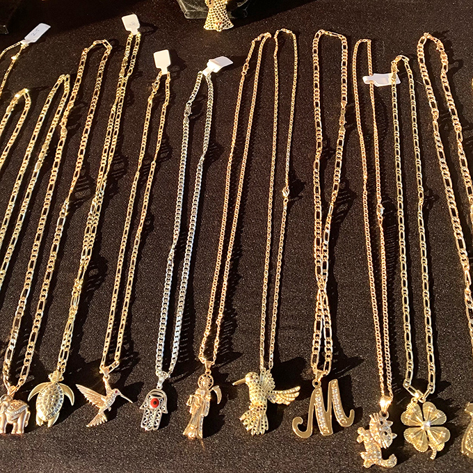 Gold chains with personality-defining pendants. Choose your character: turtle enthusiast, angel investor, or simply the letter "M."