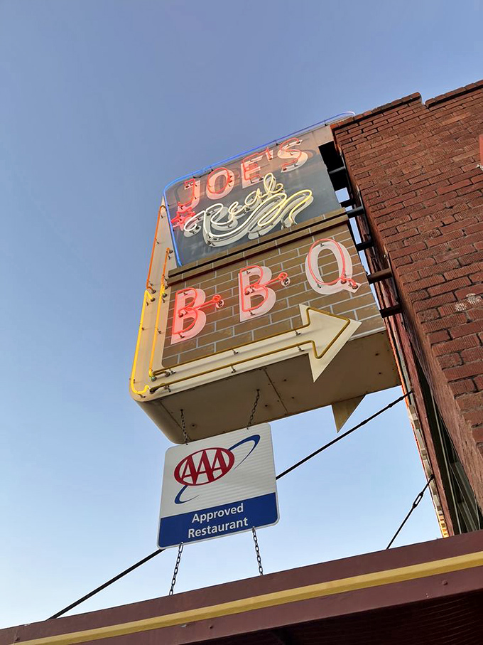 That neon sign doesn't just advertise &ndash; it beckons like a barbecue lighthouse guiding hungry souls to smoky salvation.