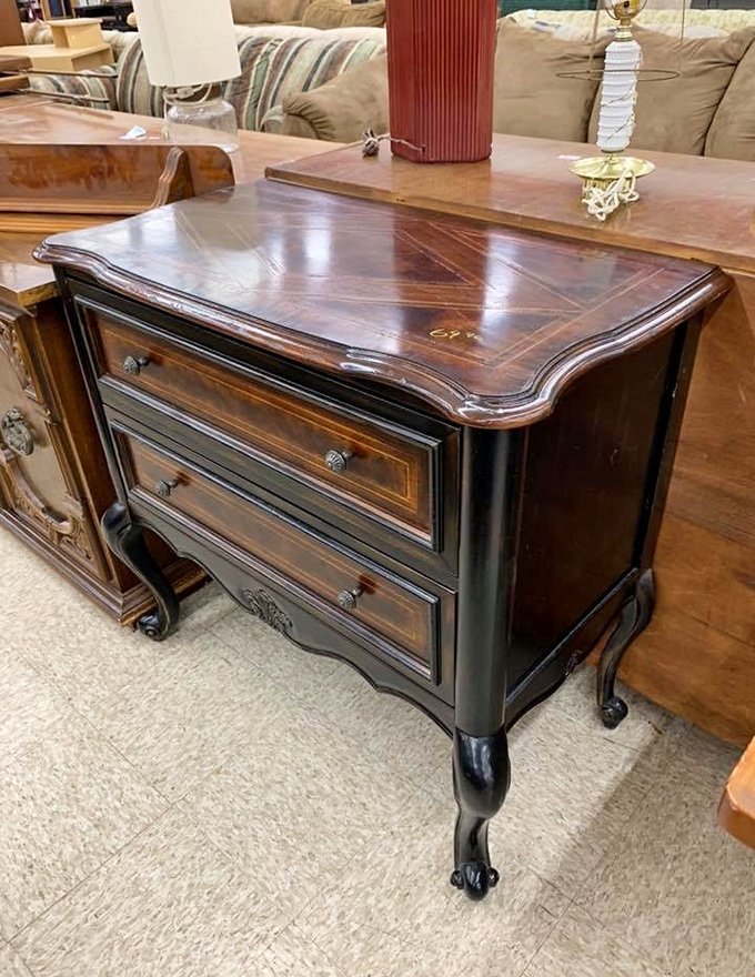 Solid wood craftsmanship from an era when furniture was built to last generations. This nightstand has probably witnessed decades of bedtime stories.