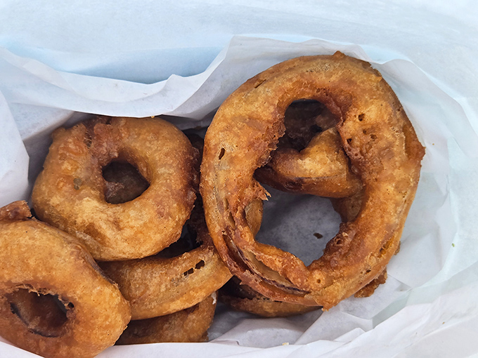 Onion rings so perfectly golden they deserve their own trophy case&mdash;crispy armor protecting sweet, tender centers.