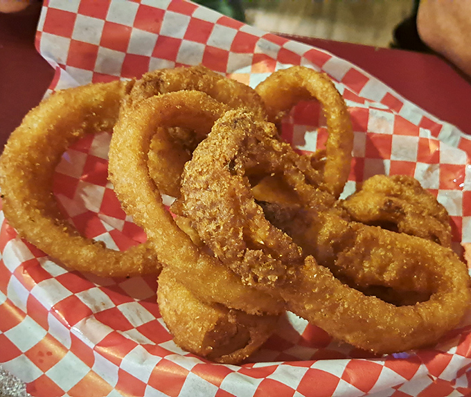 Onion rings with that perfect golden crunch. Served in a checkered basket &ndash; the universal signal for "good times ahead."