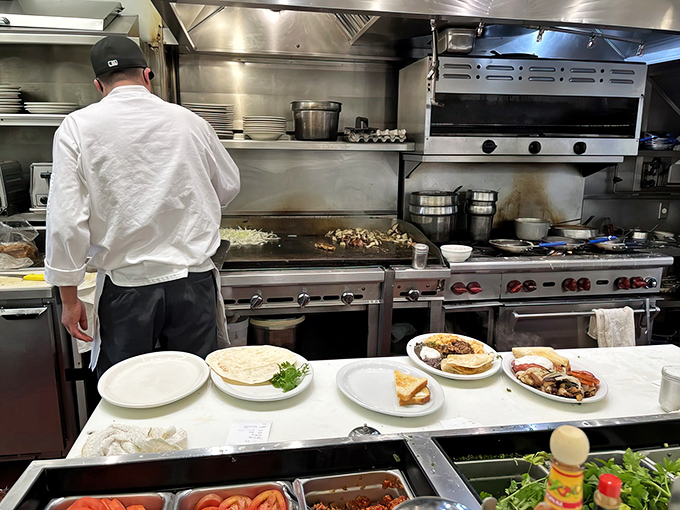 Behind the scenes of breakfast perfection. Like watching a delicious orchestra, each cook playing their part in the morning symphony.