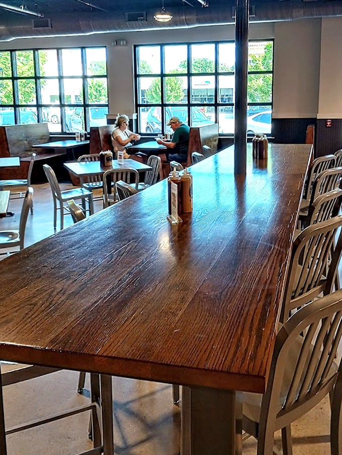 Polished wood tables bathed in natural light – the calm before the delicious storm of barbecue that's about to grace these surfaces.