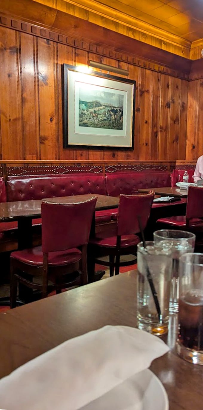 Red leather booths and wood paneling create the perfect atmosphere for important decisions, like whether to order dessert.