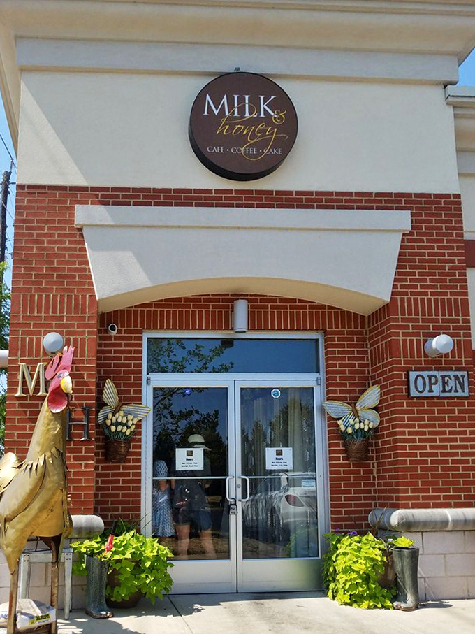 The circular Milk & Honey sign flanked by whimsical metal roosters&mdash;a promise of farmhouse flavors without the actual farm work.