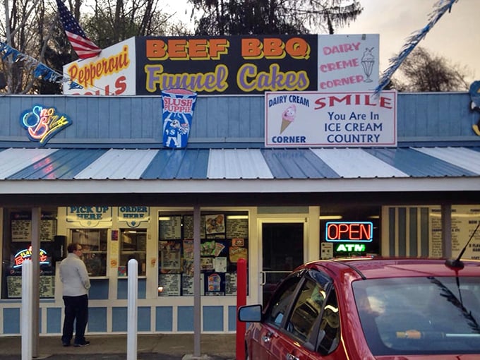 Even at dusk, Dairy Creme Corner's colorful signs beckon hungry travelers with promises of pepperoni rolls, BBQ, and funnel cakes that won't disappoint.