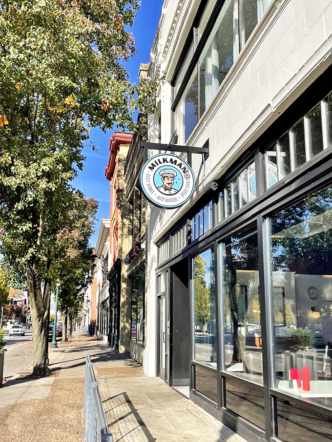 Milkman's exterior sign hangs like a beacon on a tree-lined Cincinnati street, guiding hungry pilgrims to burger salvation.