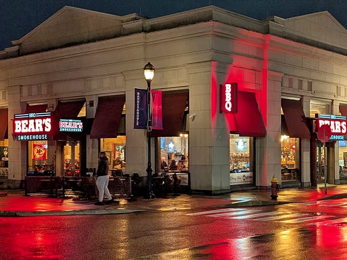 After dark, that glowing red sign transforms the corner into a beacon of barbecue hope for hungry night owls.