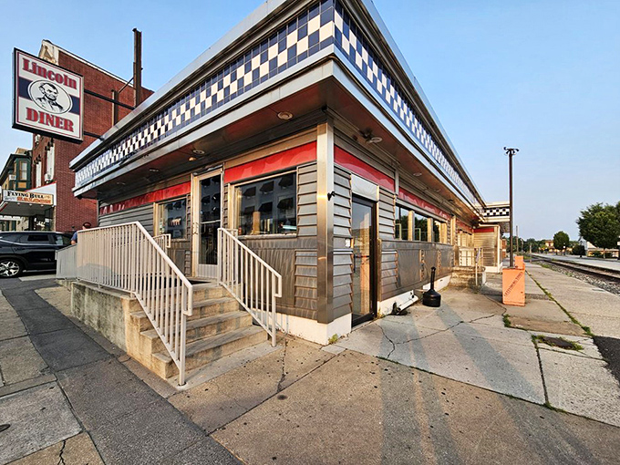 The corner view showcases that distinctive checkerboard trim&mdash;a diner signature that says "serious comfort food served here" to passing travelers.