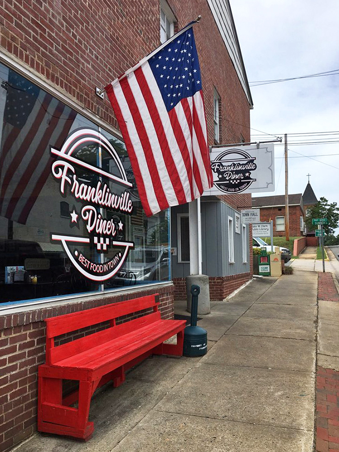 That red bench and American flag aren't just decorations—they're a promise that some traditions are worth preserving, especially when they taste this good.