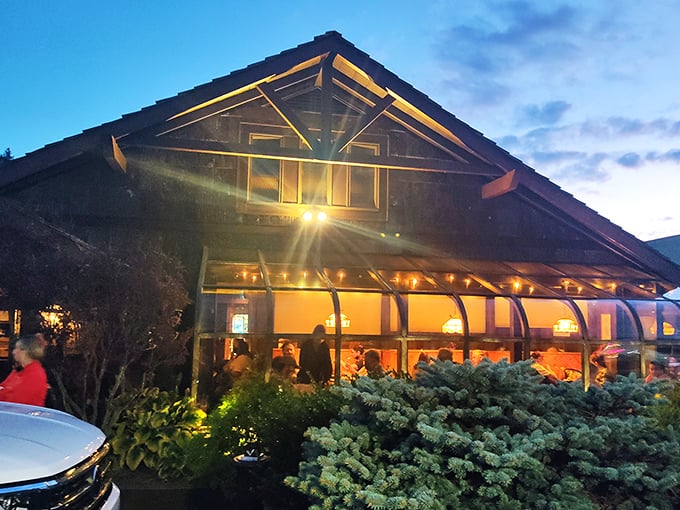 As evening falls, the restaurant glows like a lantern in the Blue Ridge Mountains, beckoning hungry travelers with promises of beef and hospitality. 