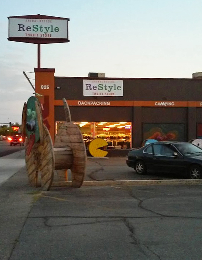 As dusk falls, Restyle's exterior glows with invitation. That giant wooden snail sculpture? Just a hint of the quirky treasures waiting inside.