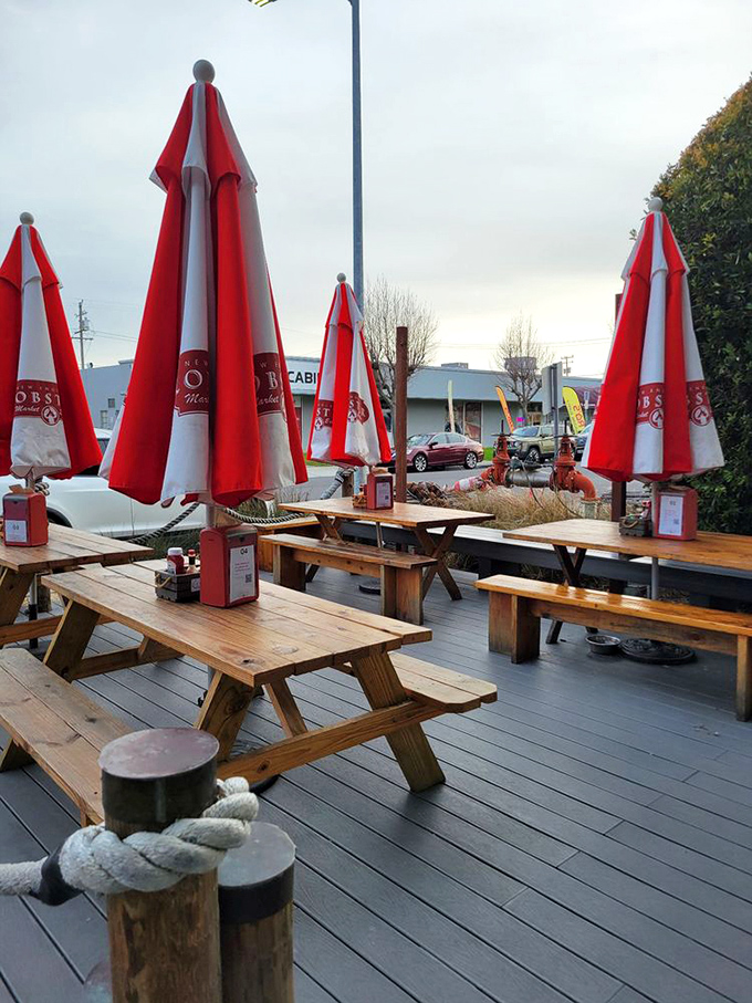 The outdoor deck with its picnic tables and red umbrellas&mdash;where lobster rolls taste even better under California sunshine.