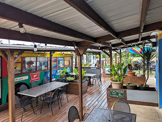 The outdoor dining area offers a tropical oasis in the heart of Kent. Those plants aren't just decoration &ndash; they're vacation vibes without the airfare.