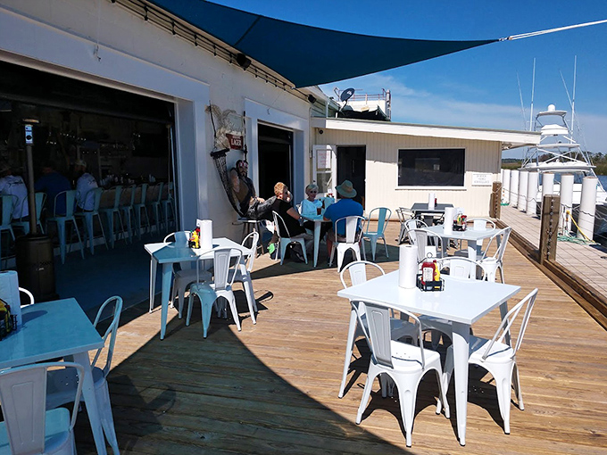 Sun-drenched waterfront dining where every table feels like the captain's table—casual luxury that defines the Florida experience.