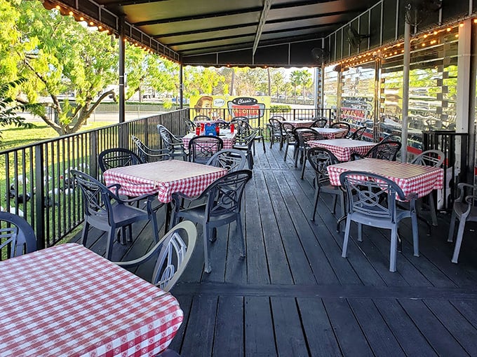 The outdoor patio with its red-checkered tablecloths offers fresh air dining without sacrificing that authentic diner charm inside.