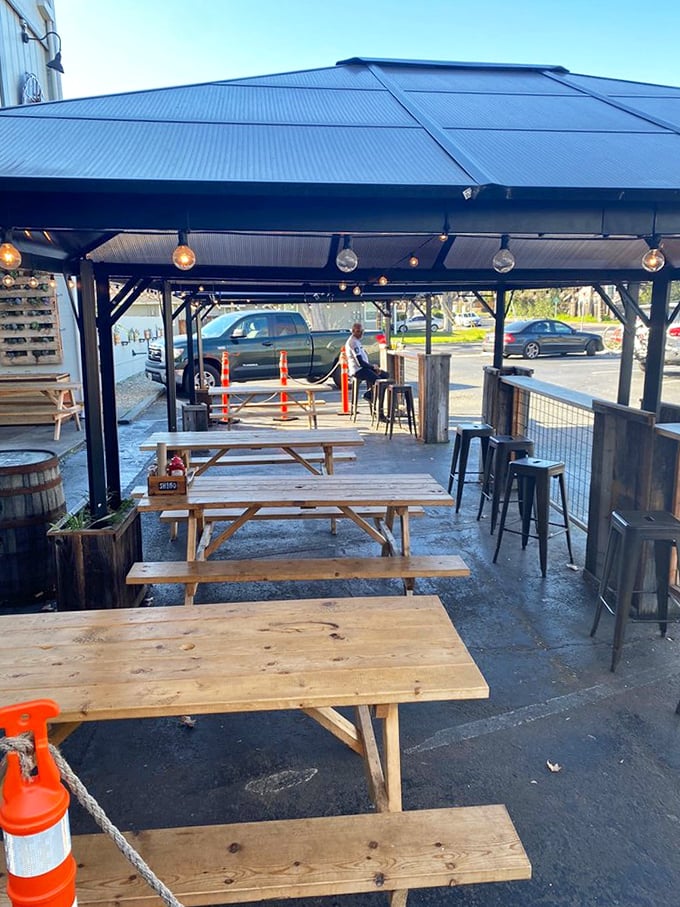Picnic tables under string lights &ndash; because barbecue tastes 37% better when eaten outdoors. That's just science.