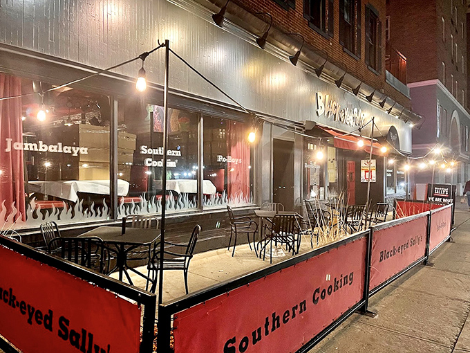 Outdoor dining that brings a taste of Bourbon Street to Asylum Street – complete with red barriers that say "good times contained within."