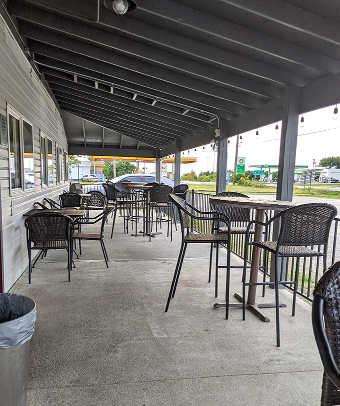 The covered porch offers al fresco dining with a side of people-watching. Those high-top tables are perfect for lingering over cold drinks on warm evenings.