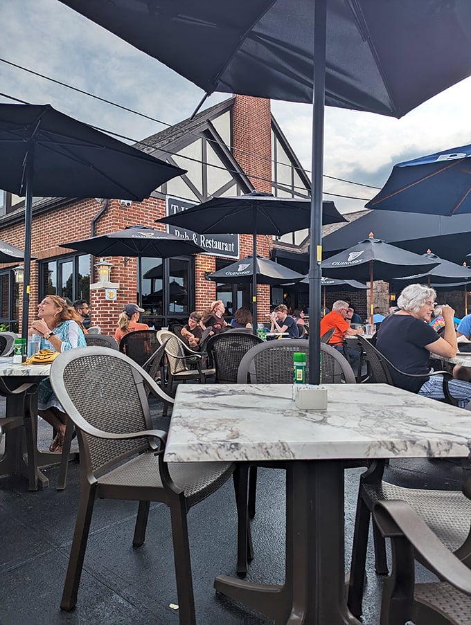 The patio at The Harp: where Cleveland summer days stretch into evening under umbrellas and the gentle clinking of glasses.