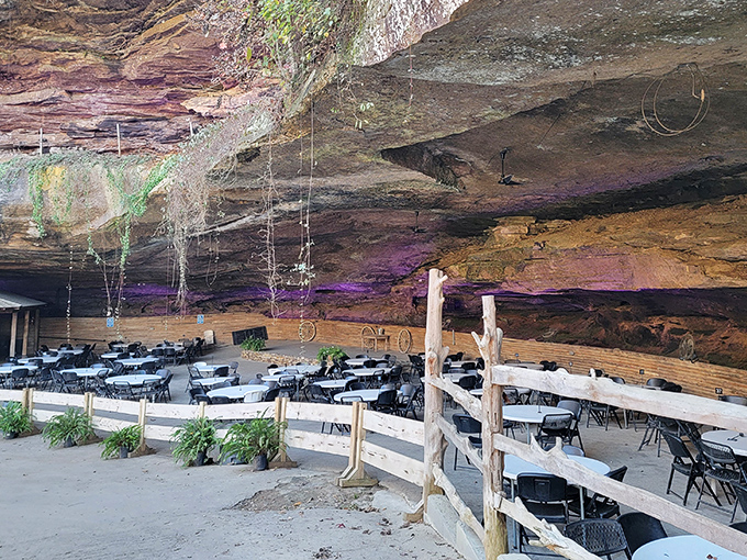The outdoor dining area proves that the best restaurant lighting isn't designed by interior decorators but by millions of years of geological processes.