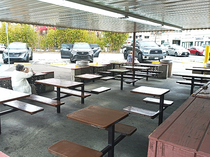 The outdoor seating area&mdash;simple, functional, perfect. When the food is this good, white tablecloths would just get in the way.