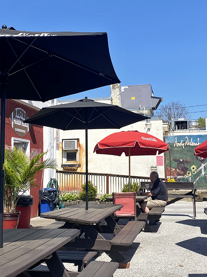 Outdoor seating where barbecue tastes even better. Something about fresh air makes sauce stains on shirts completely acceptable.