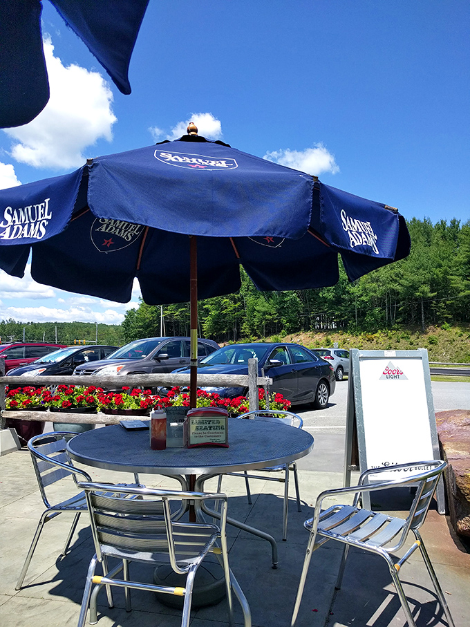 Summer dining under blue umbrellas with views of New Hampshire greenery &ndash; breakfast tastes even better with fresh mountain air.
