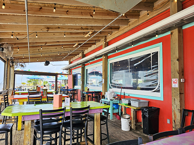 Outdoor seating where every table is the best seat in the house&mdash;colorful, casual, and kissed by Gulf breezes.