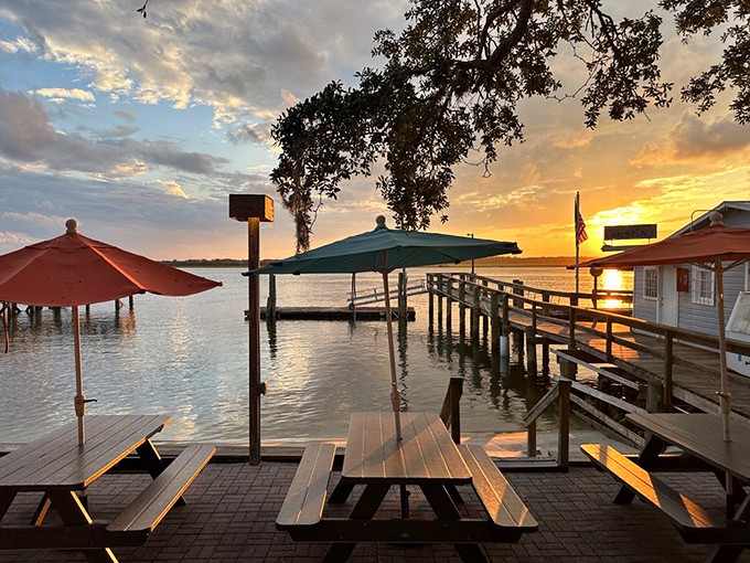 Sunset transforms the waterfront dining area into nature's dinner theater. Those picnic tables have witnessed more "oohs" and "aahs" than a fireworks show.