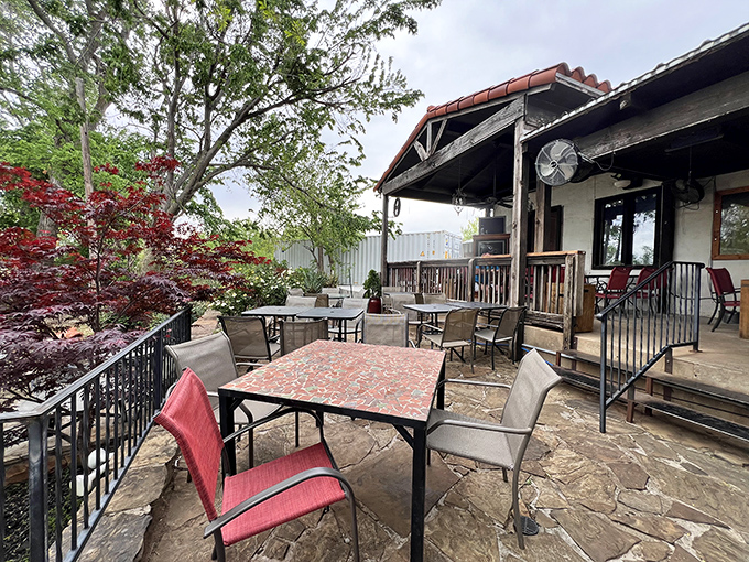 The patio offers a breath of fresh air with comfortable seating among greenery &ndash; nature's dining room for enjoying smoky treasures.
