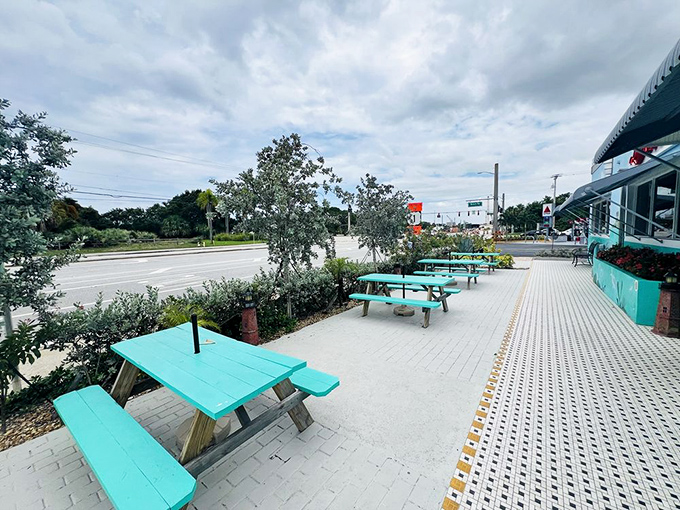Outdoor seating that captures Florida's breezy charm. These teal picnic tables have hosted everything from first dates to family reunions.