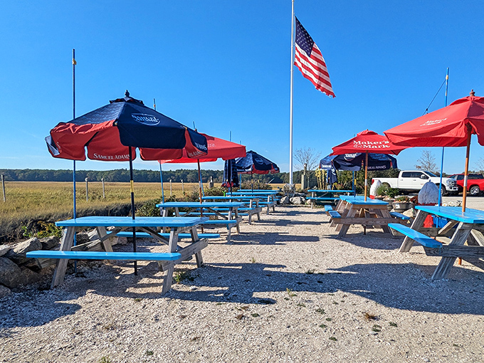 Outdoor picnic tables under red and blue umbrellas offer al fresco dining with an American flag standing proud&mdash;seafood just tastes better with a side of fresh air.