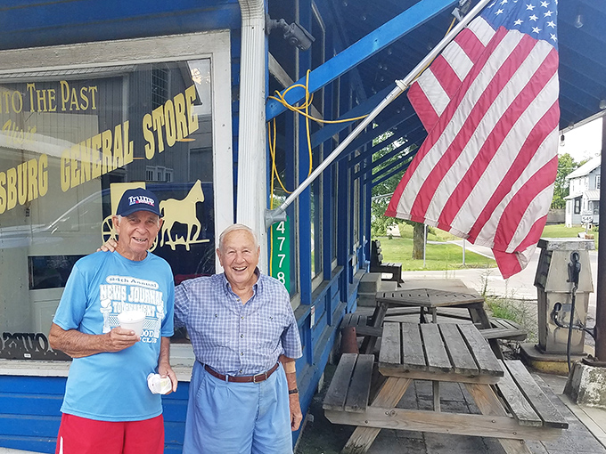 Two generations sharing ice cream outside a historic general store &ndash; this is Norman Rockwell territory, alive and thriving.