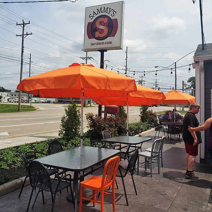 Orange umbrellas creating islands of shade for outdoor diners. Even the sun wants to hang out at Sammy's.