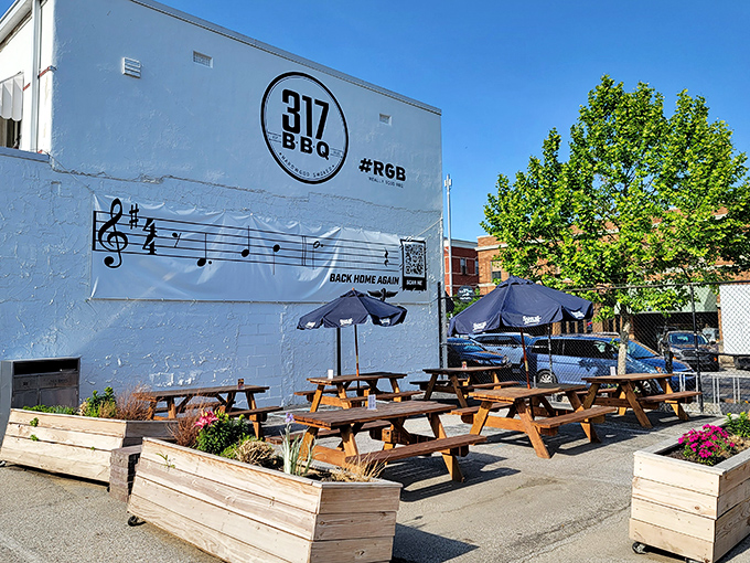 The outdoor patio &ndash; where picnic tables, umbrellas, and the wafting scent of smoke create the perfect urban oasis for meat enthusiasts.