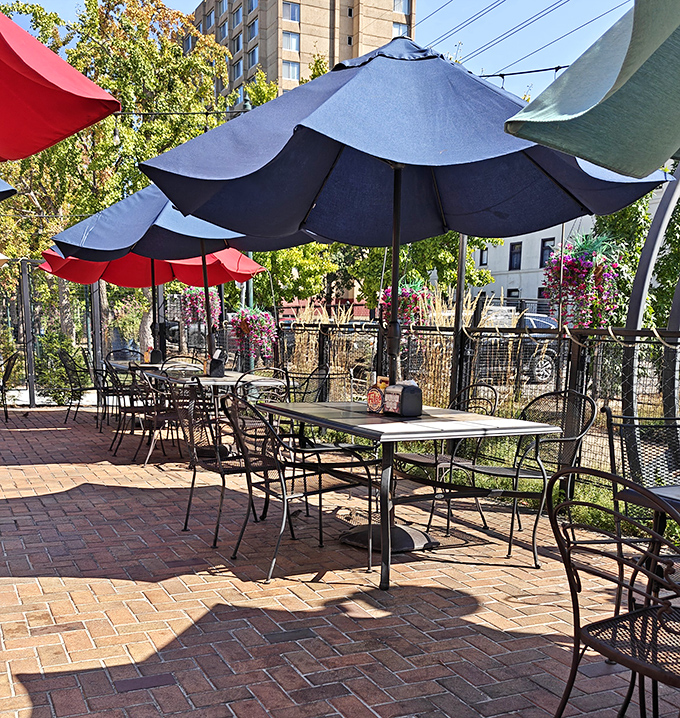 The patio at Fitz's offers al fresco dining under cheerful umbrellas, where summer breezes complement every bite and the people-watching is five-star.