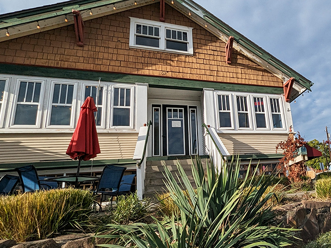 Garden-framed entrance that sets the stage for culinary delight. Those ornamental grasses wave hello like nature's own ma&icirc;tre d'.