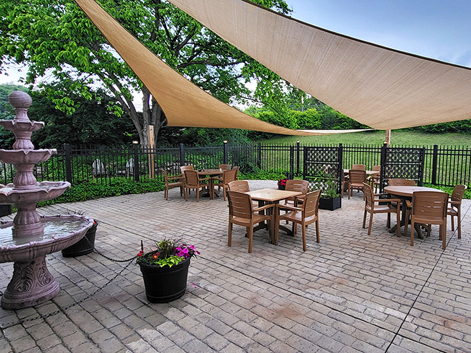 Outdoor dining under canvas sails, where the gentle splash of the fountain provides the perfect soundtrack to a summer meal.