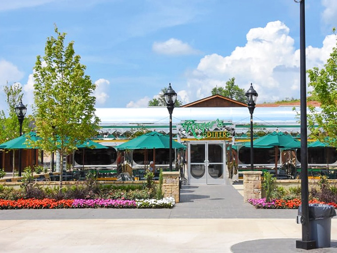 Flower beds frame the approach to Roger's like a colorful welcome mat, the neon sign promising a respite from chain restaurant monotony.