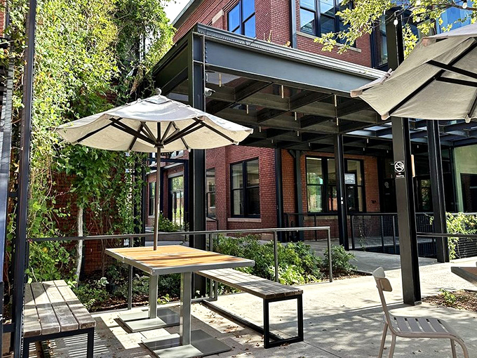 Outdoor tables bathed in dappled sunlight &ndash; nature's perfect filter for both your meal and your inevitable Instagram post.