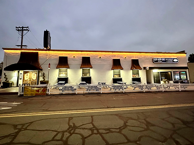 Even the exterior knows how to glow up for the evening crowd, lit like a beacon for hungry souls.